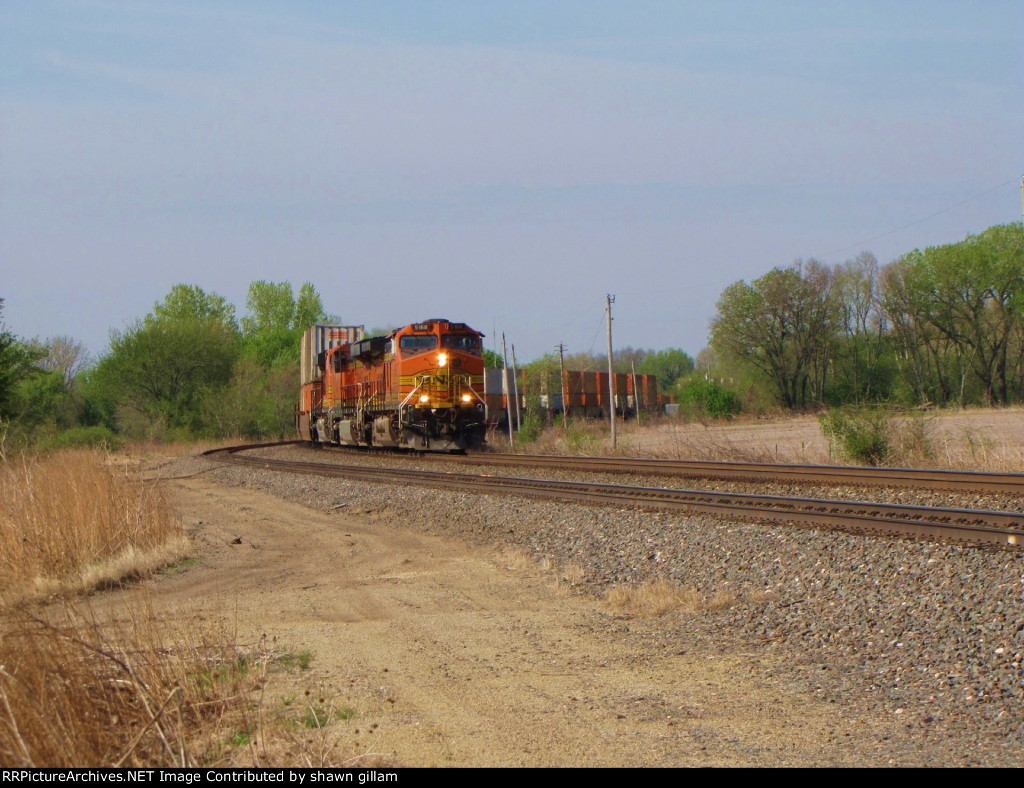 BNSF 5168 leads a stack train onto the main for a meet.